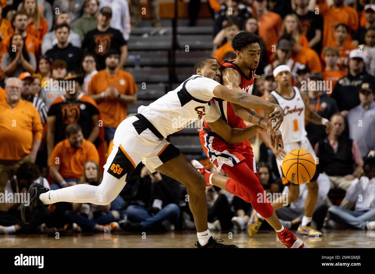 Oklahoma State's Bryce Thompson, left, and Mississippi's Myles Burns ...