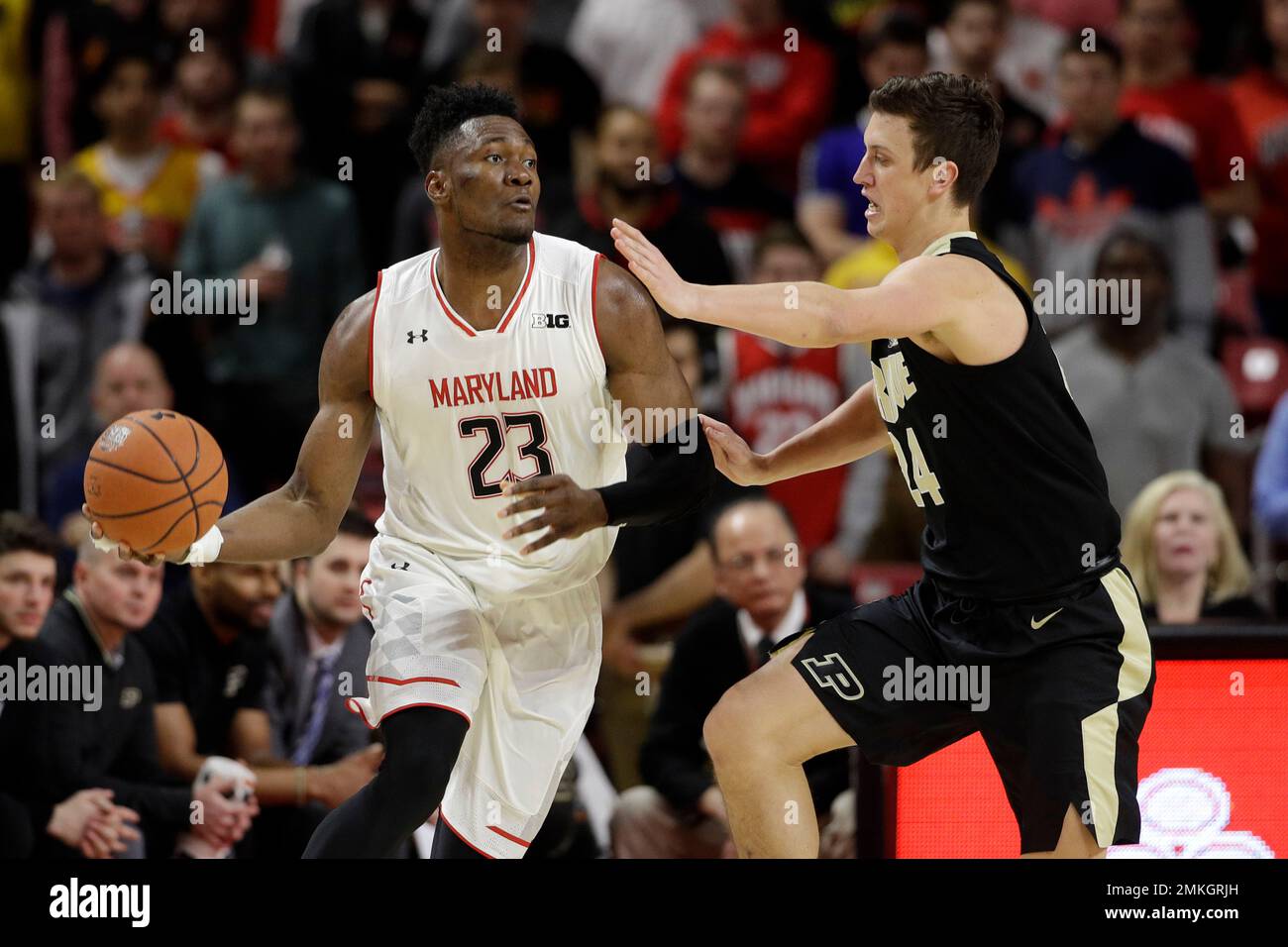 Maryland forward Bruno Fernando, left, of Angola, drives the ball ...