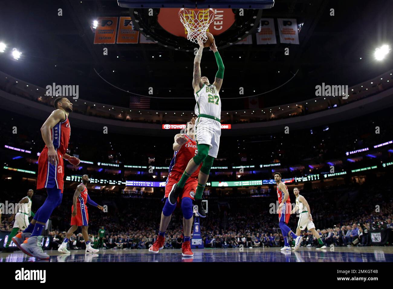 Boston Celtics' Daniel Theis (27) goes up for a shot past Philadelphia ...