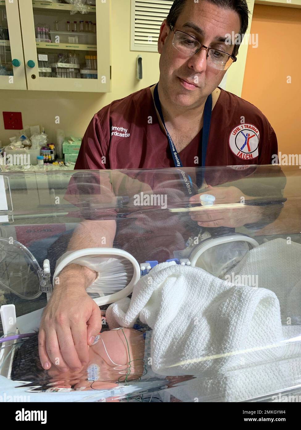 Doctor Timothy Hardcastle treats a baby in hospital after she was ...