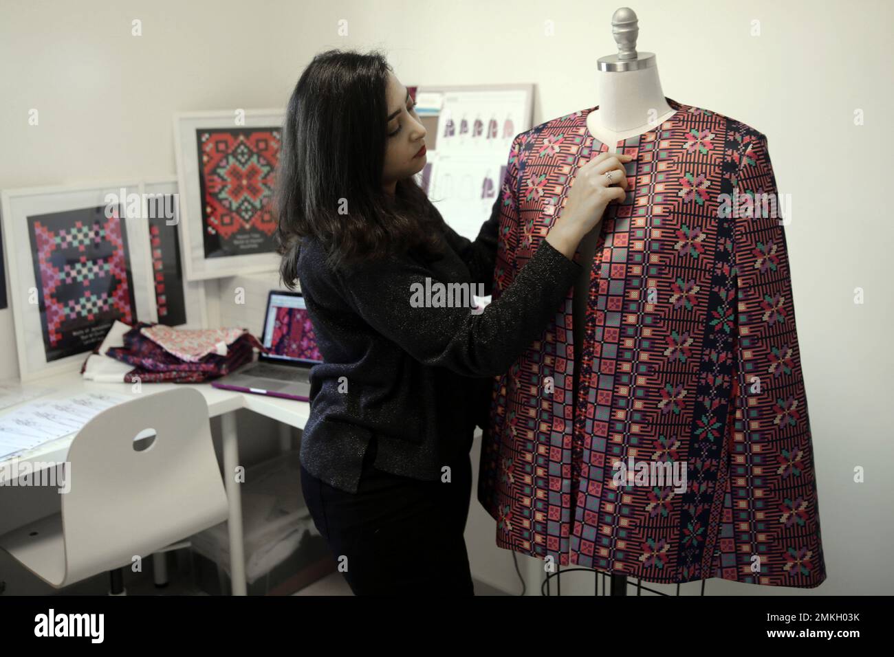 In this Tuesday, Jan. 29, 2019 photo, designer Natalie Tahhan works on ...