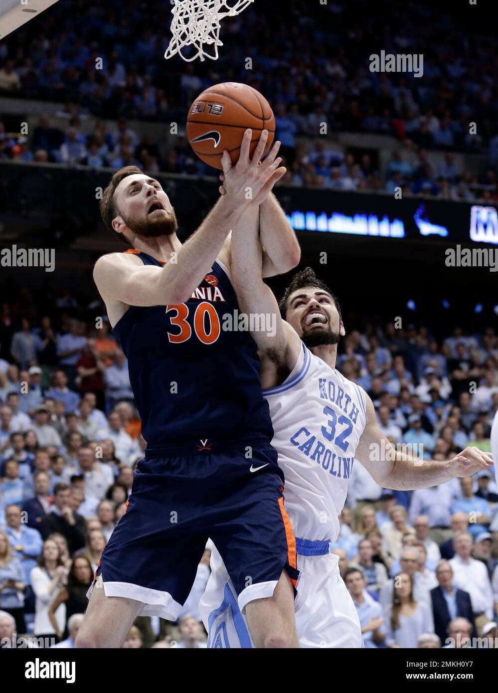 North Carolina's Luke Maye (32) reaches to block Virginia's Jay Huff ...
