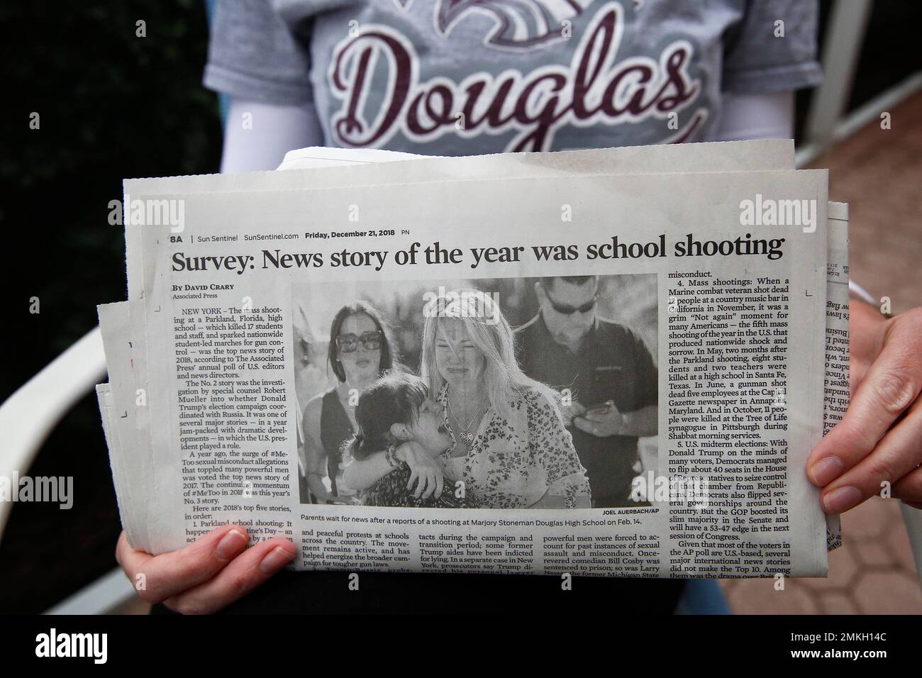 HOLD for Kelli Kennedy Story - Mechelle Boyle holds a newspaper with an ...