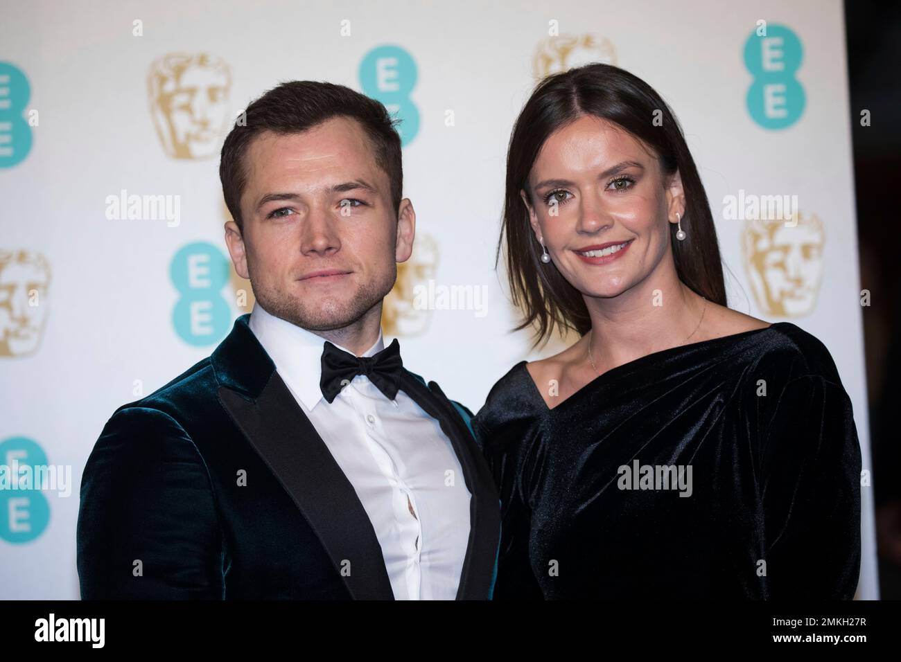 Taron Egerton and Emily Thomas pose for photographers upon arrival at ...