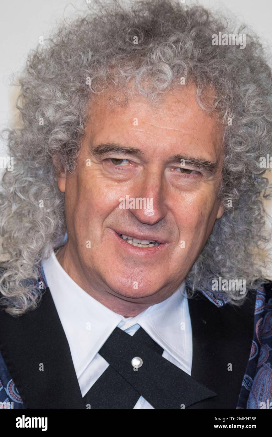 Brian May poses for photographers upon arrival at the BAFTA Film Awards ...