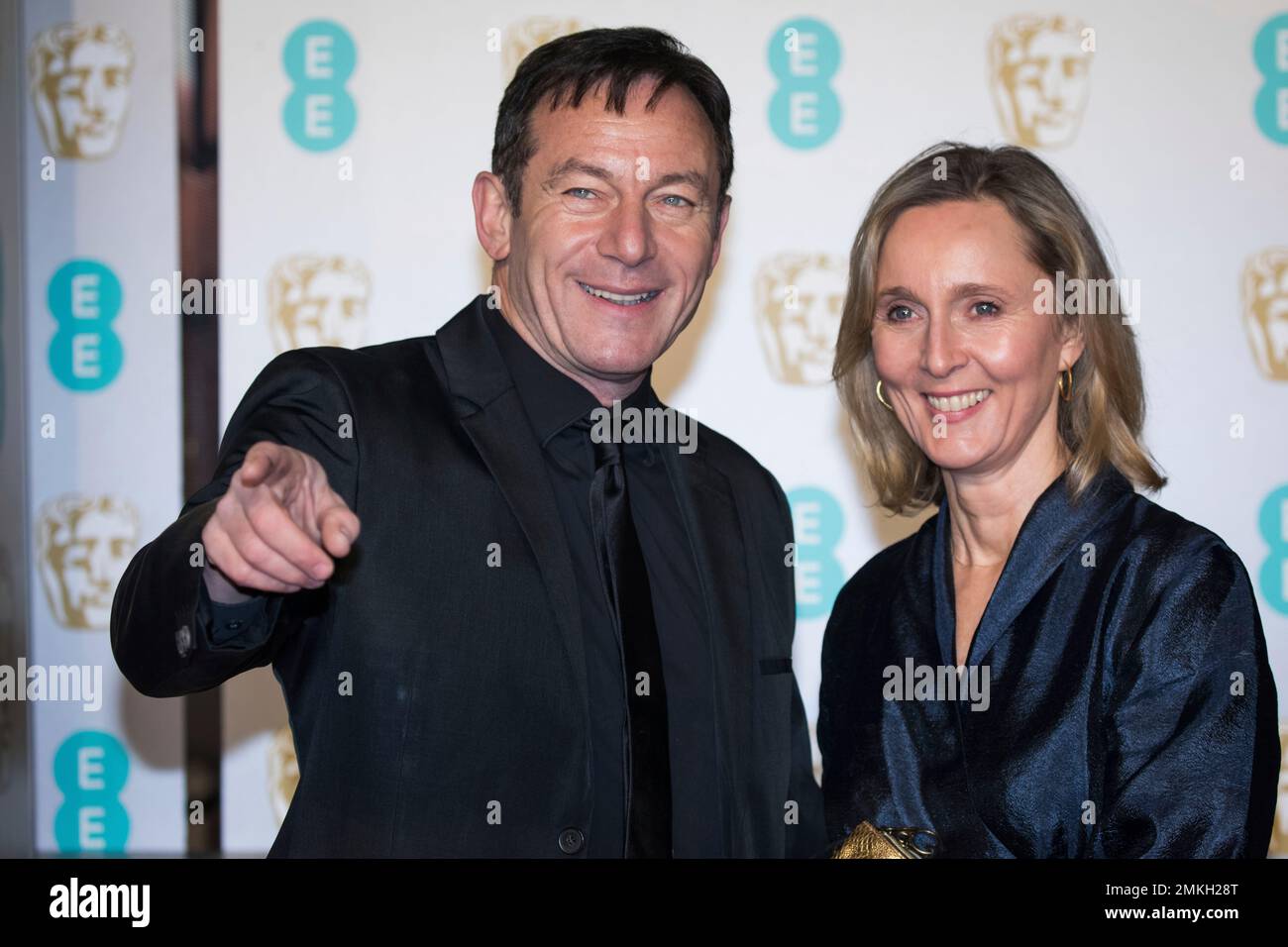 Jason Isaacs and Emma Hewitt pose for photographers upon arrival at the ...