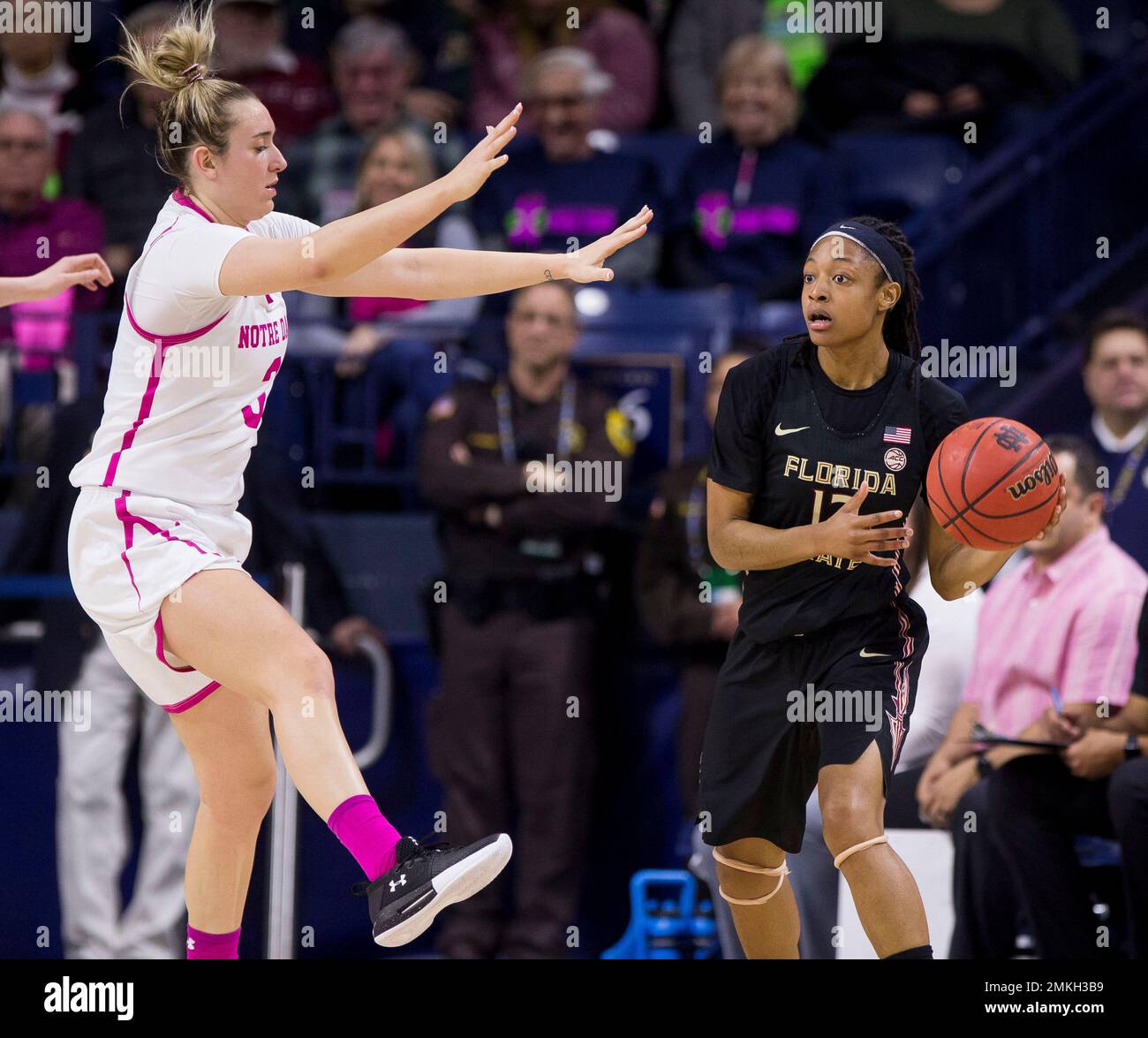 Florida State's Nicki Ekhomu (12) looks to pass around Notre Dame's ...