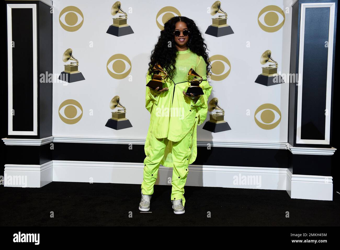 H.E.R. poses in the press room with the awards for best R&B album for ...