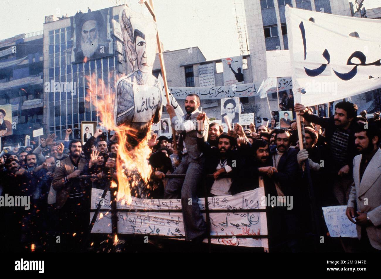 FILE - In an undated photo from 1979, protestors burn an effigy of Shah ...