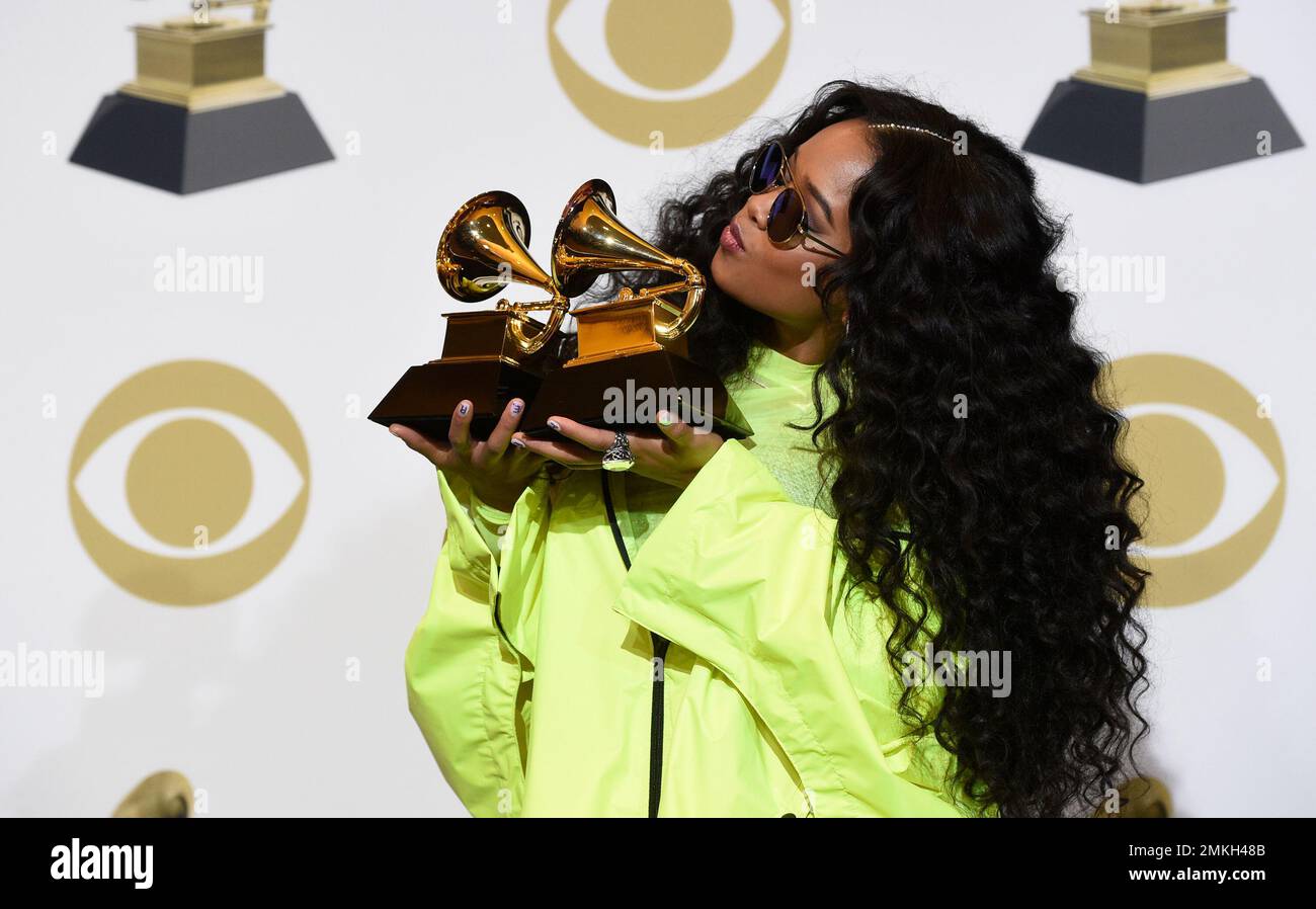 H.E.R. poses in the press room with the awards for best R&B album for ...