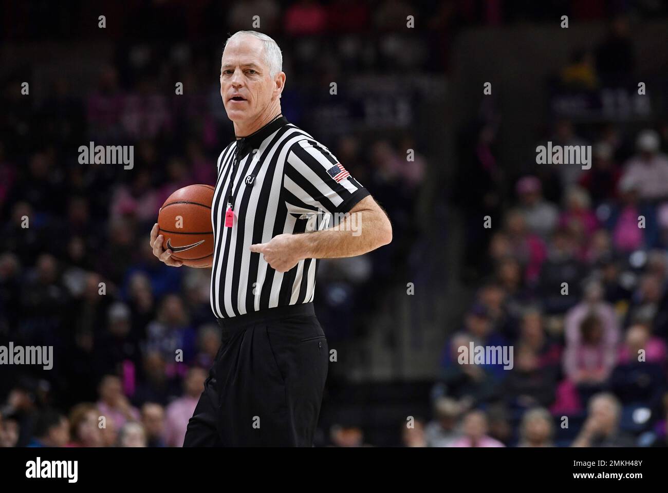 Referee Bruce Morris officiates an NCAA college basketball game between ...