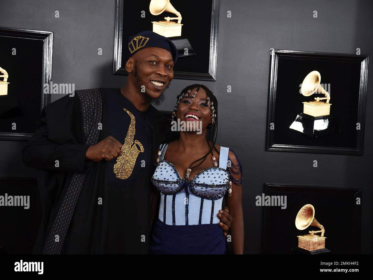 Seun Kuti, left, and Yetunde George Ademiluyi arrive at the 61st annual ...