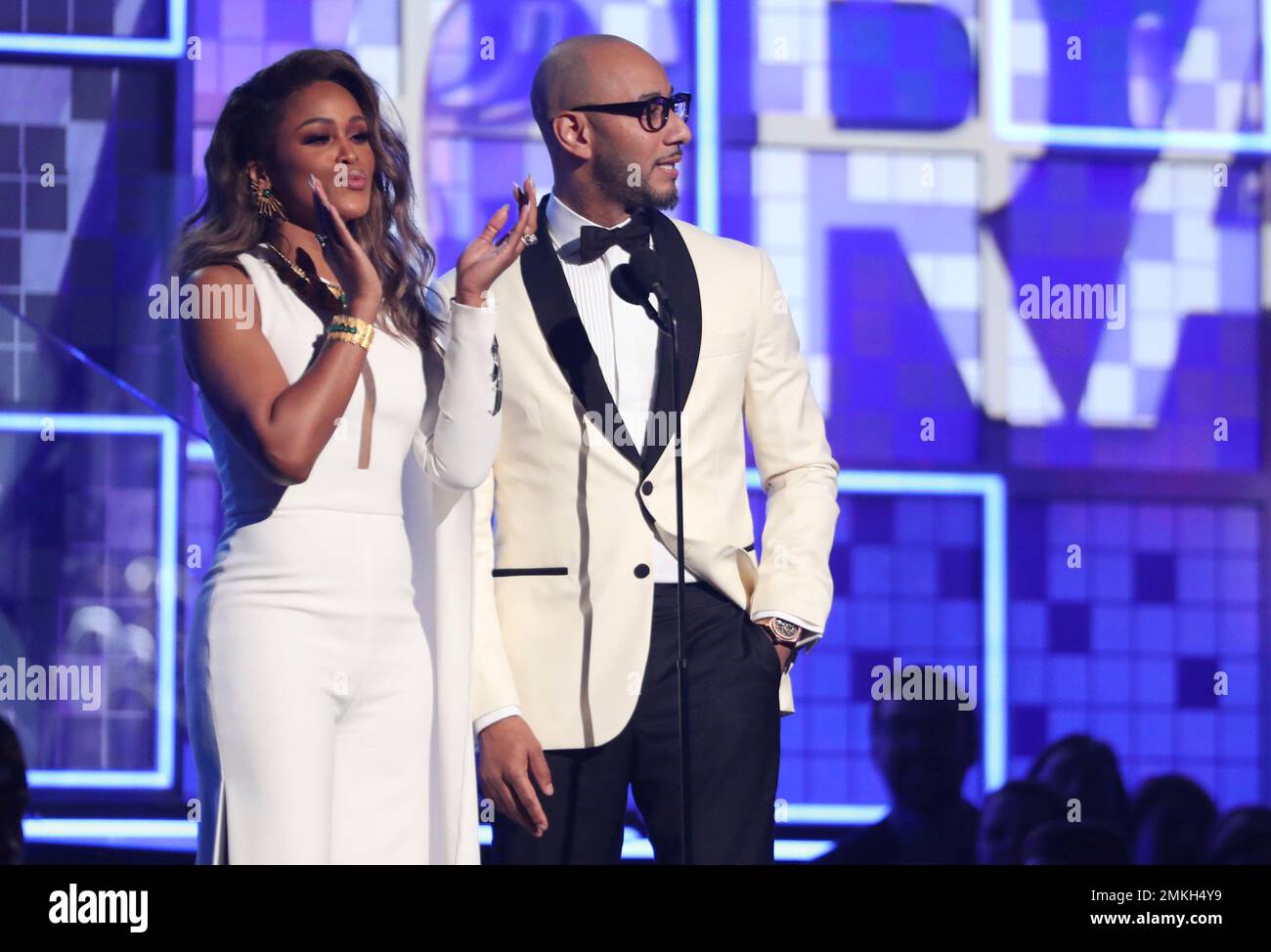 Eve, left, and Swizz Beatz introduce a performance by Travis Scott at ...