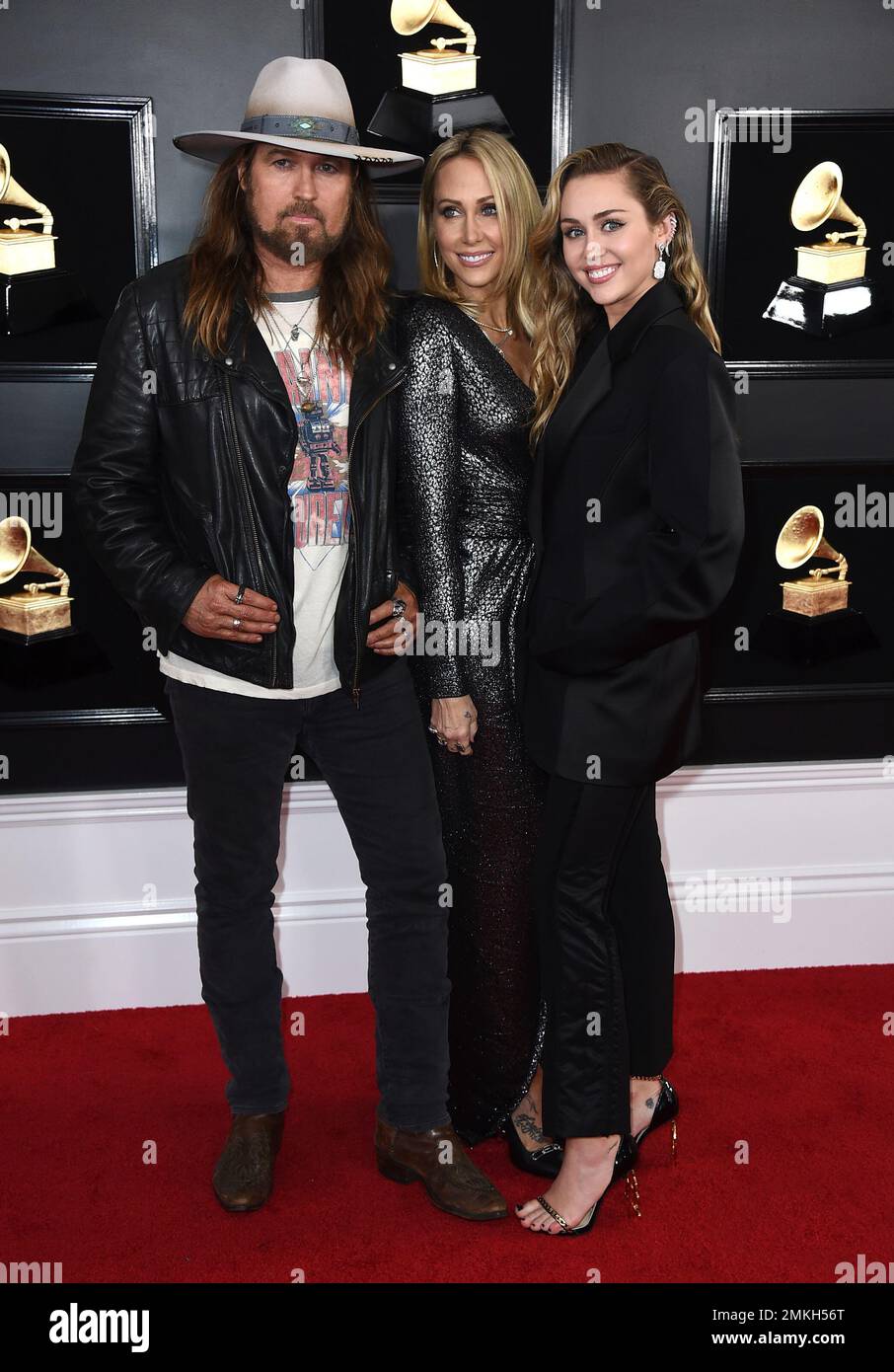 Billy Ray Cyrus, from left, Tish Cyrus, and Miley Cyrus arrive at the ...