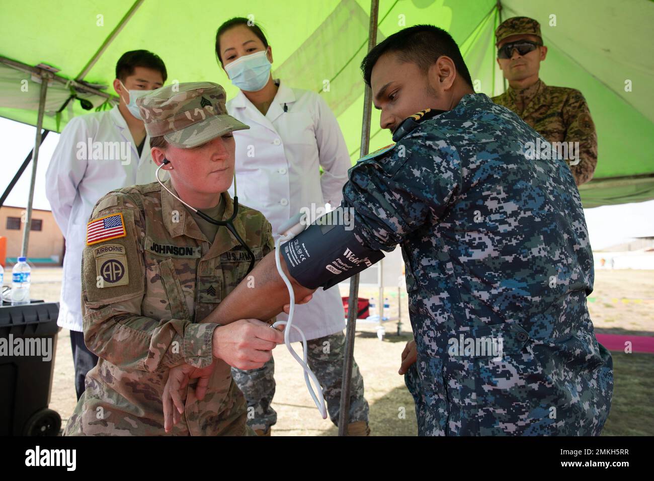 Sgt. Shannon Johnson, combat medic, left, 1-2 Stryker Brigade Combat ...