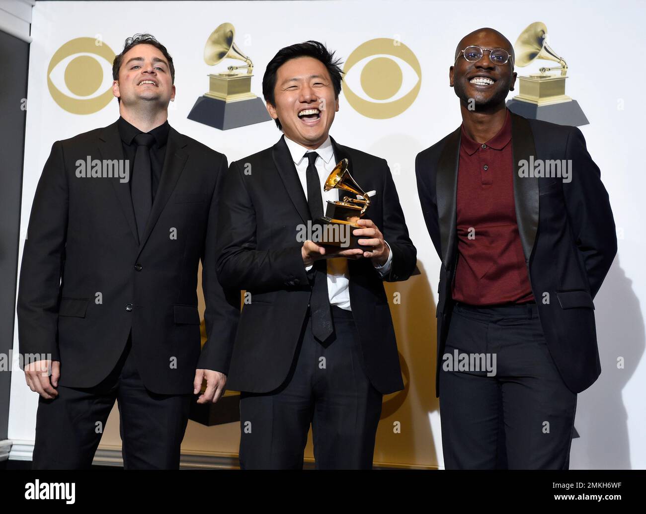 Jason Cole, from left, Hiro Murai and Ibra Ake pose in the press room ...