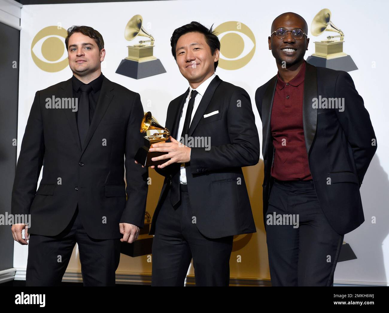 Jason Cole, from left, Hiro Murai and Ibra Ake pose in the press room ...