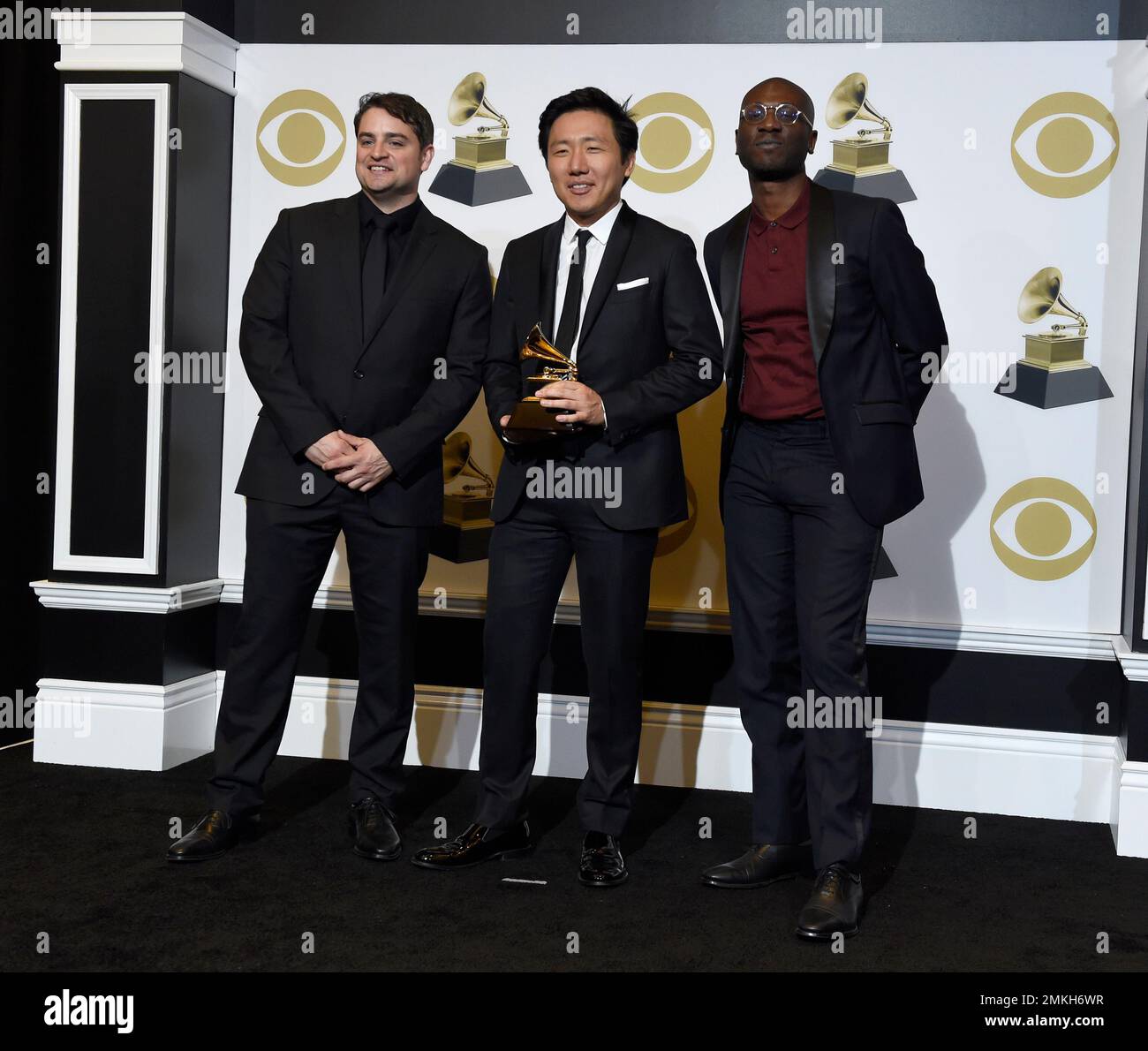 Jason Cole, from left, Hiro Murai and Ibra Ake pose in the press room ...