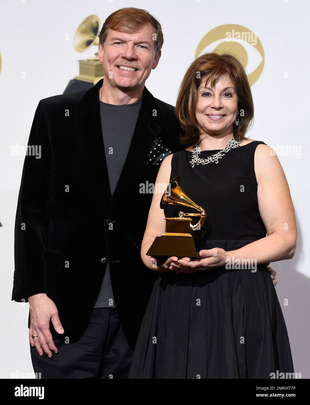 Tim Handley, left, and JoAnn Falletta pose in the press room with the ...