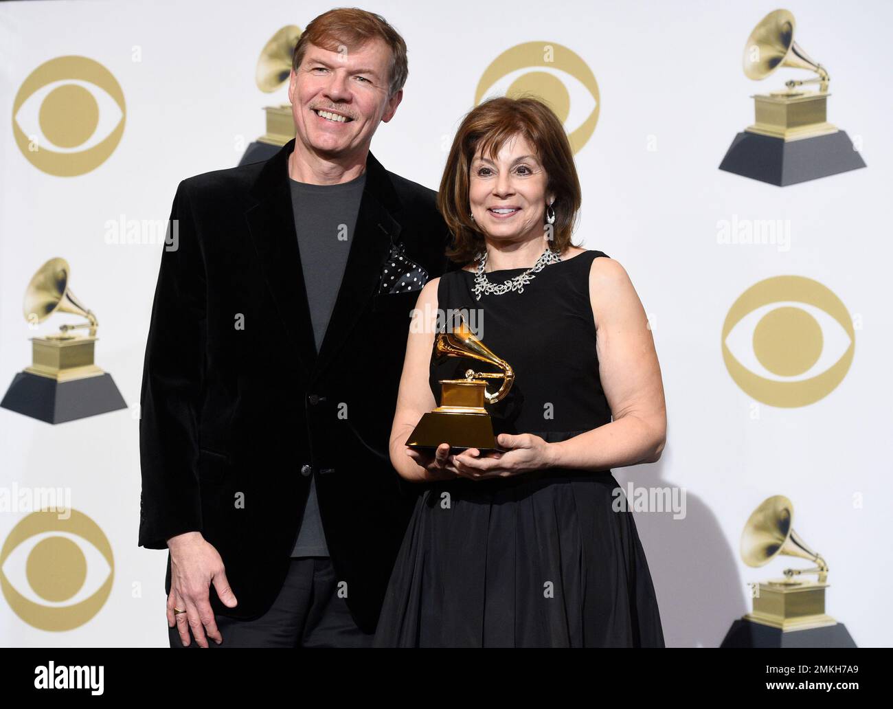 Tim Handley, left, and JoAnn Falletta pose in the press room with the ...