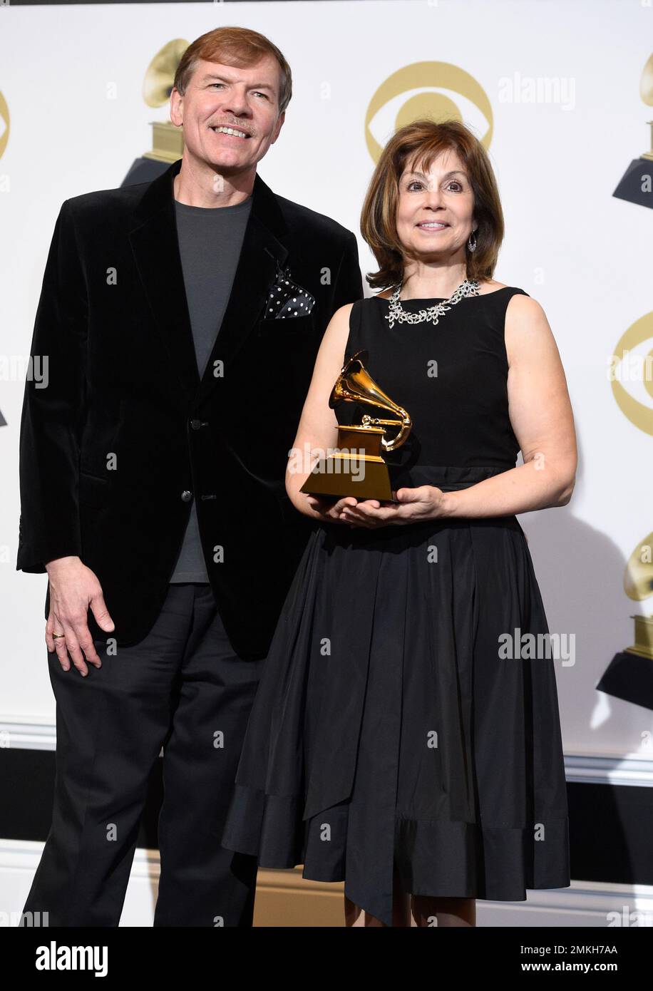 Tim Handley, left, and JoAnn Falletta pose in the press room with the ...