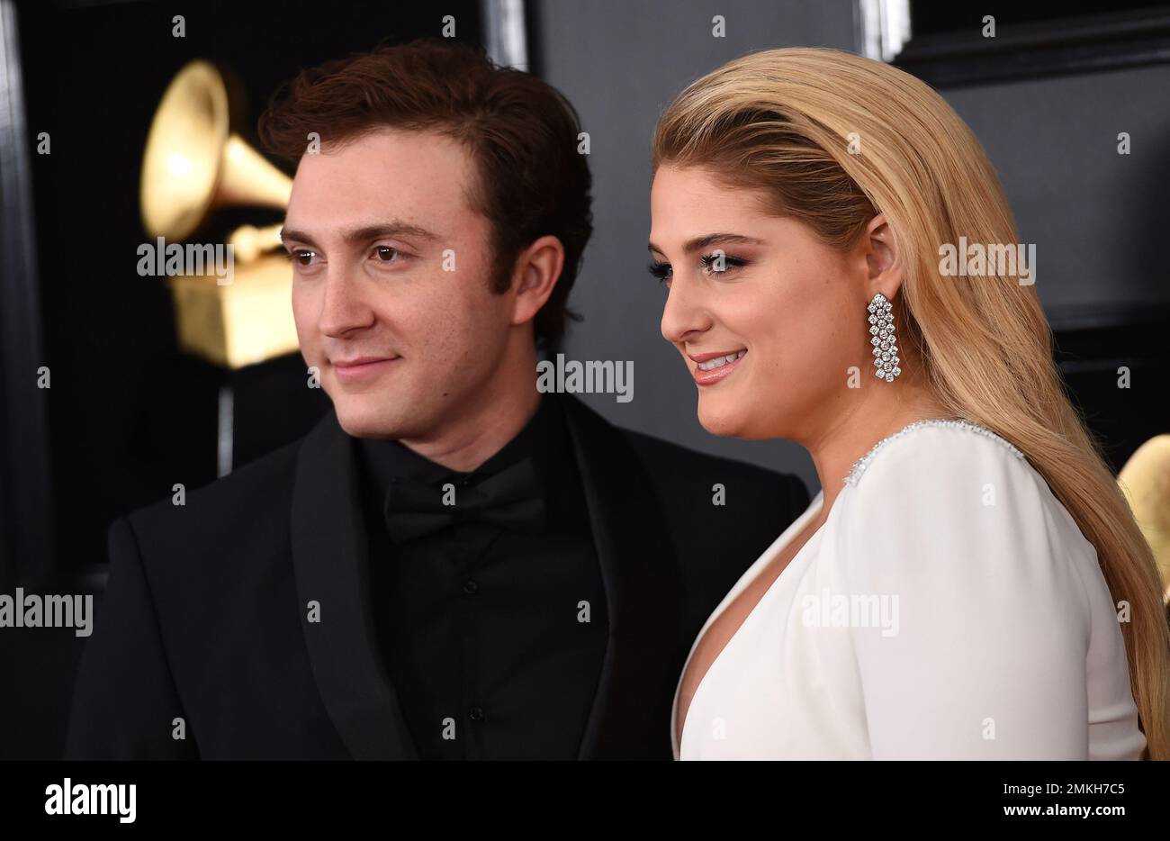 Daryl Sabara, left, and Meghan Trainor arrive at the 61st annual Grammy ...