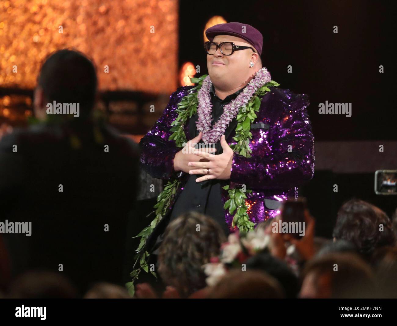 Kalani Pe'a walks on stage to accept the award for best regional roots ...