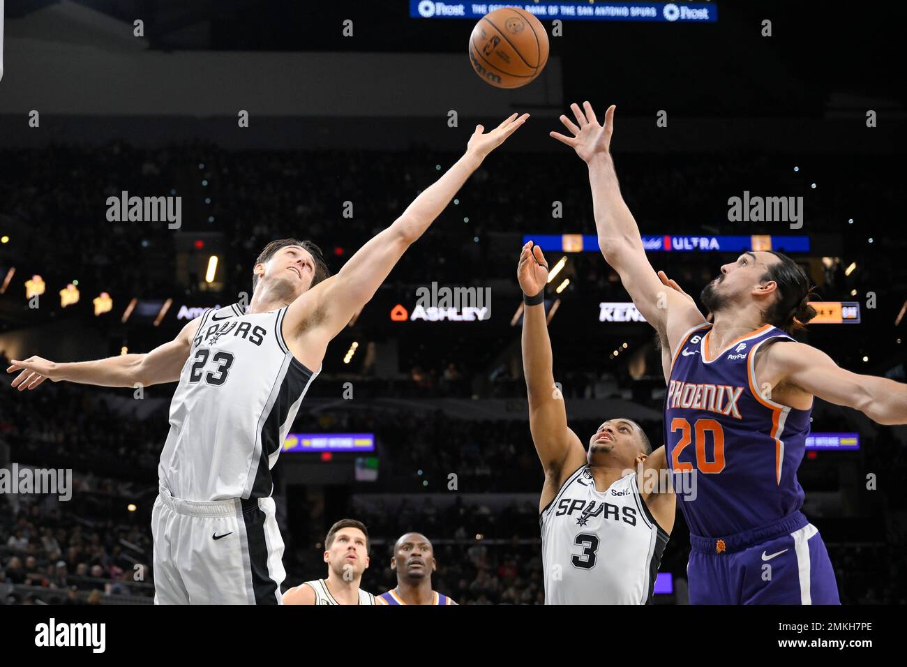 Phoenix Suns' Dario Saric (20) grabs for a rebound against San Antonio ...