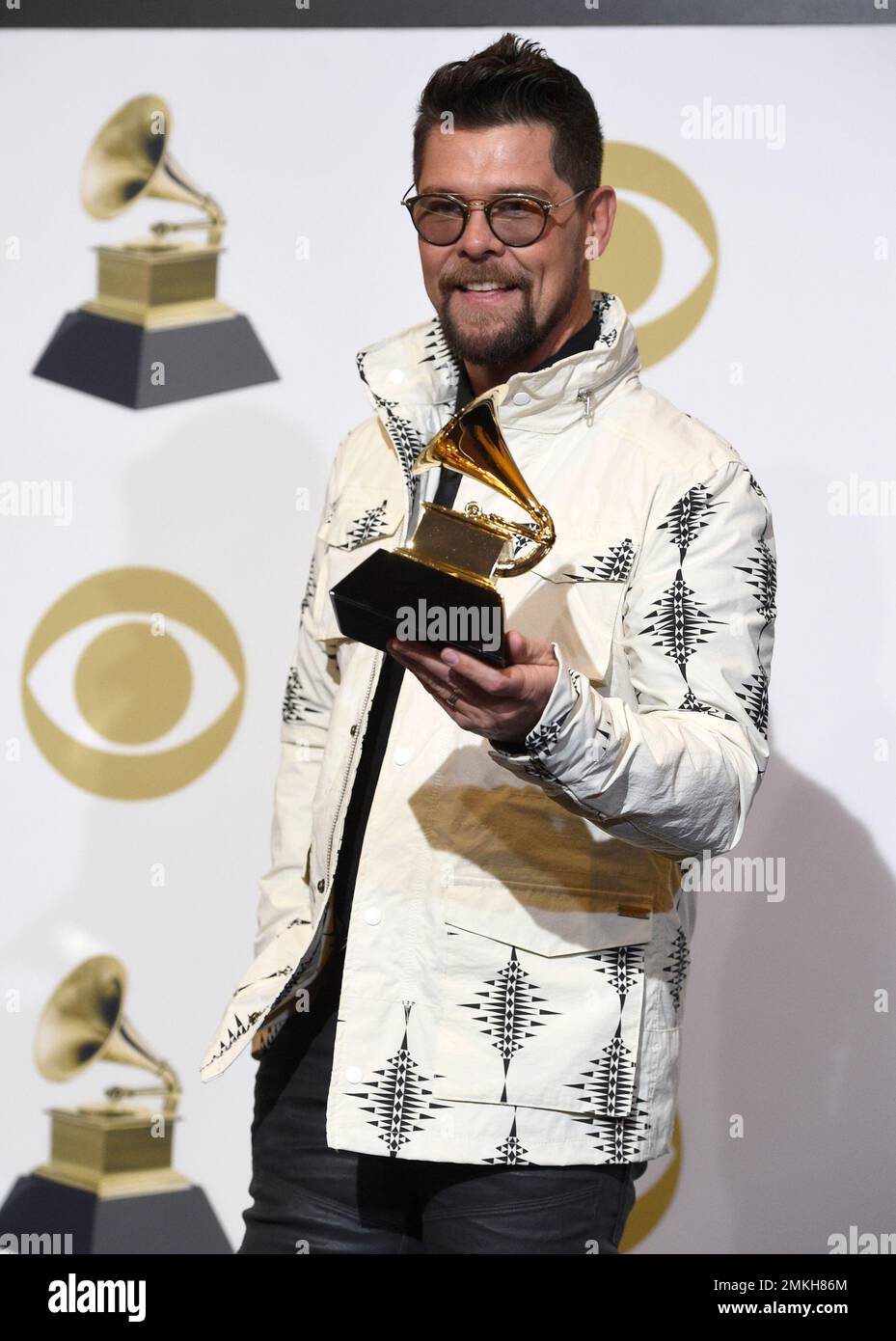 Jason Crabb poses in the press room with the award for best roots ...
