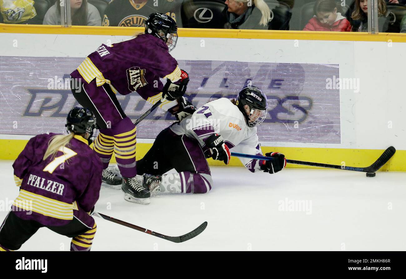 Team Szabados defender Michelle Picard, right, tries to clear the puck ...