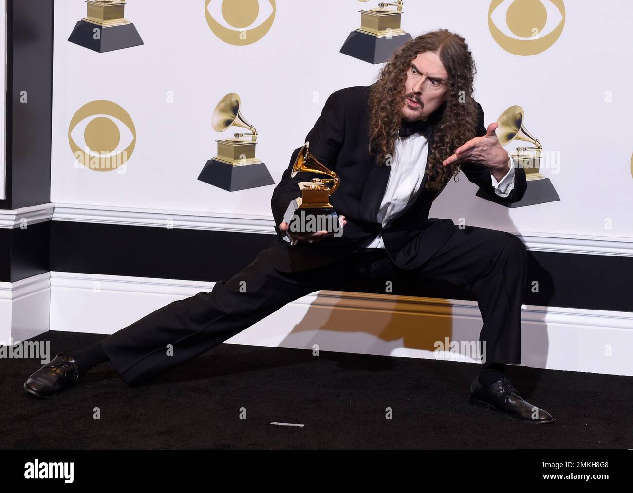 "Weird Al" Yankovic poses in the press room with the award for best ...