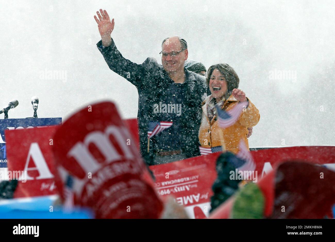 Democratic Sen. Amy Klobuchar and her husband, John Bessler, wave to ...