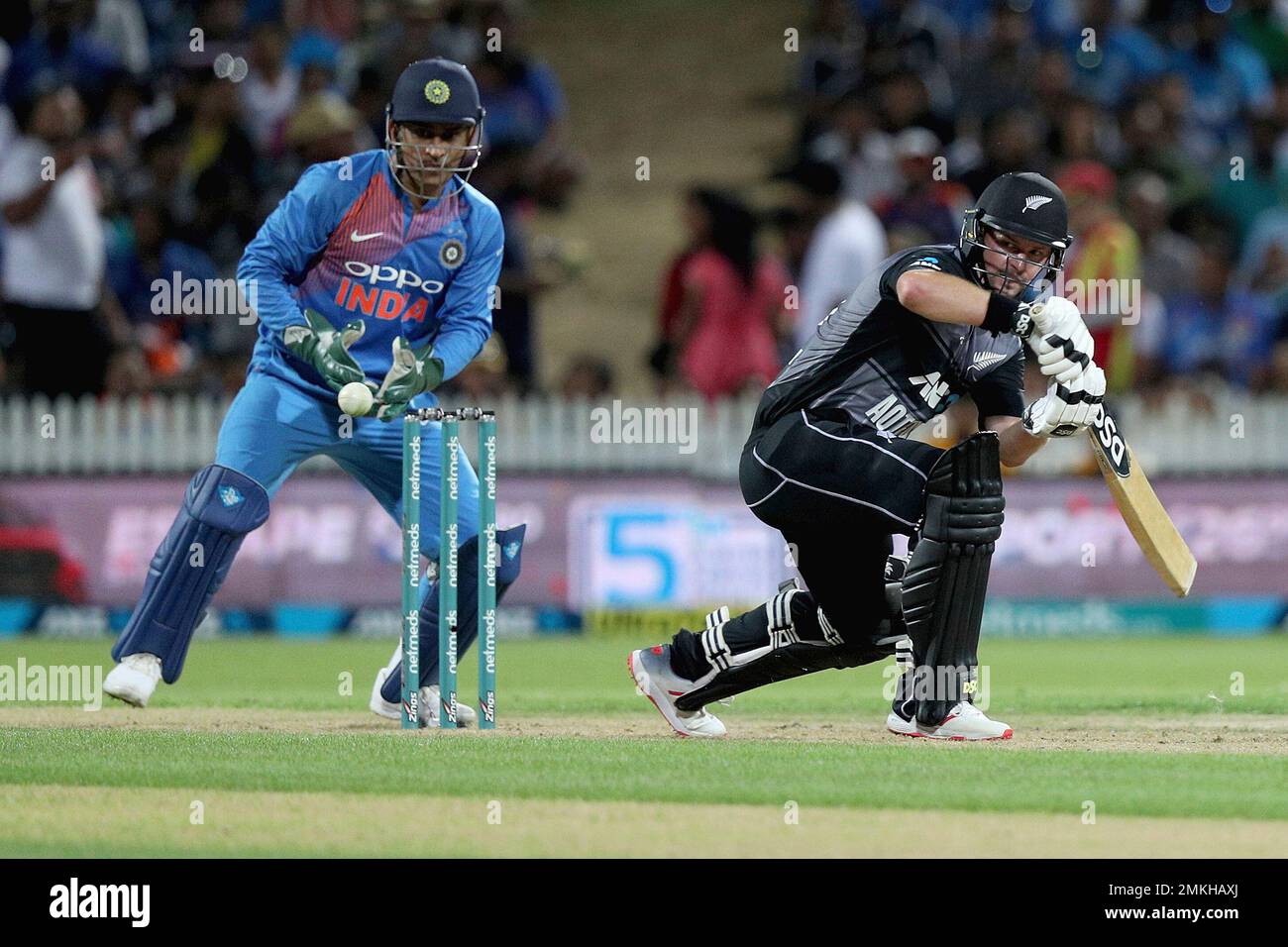 New Zealand's Colin Munro bats and is fielded by India's wicketkeeper ...