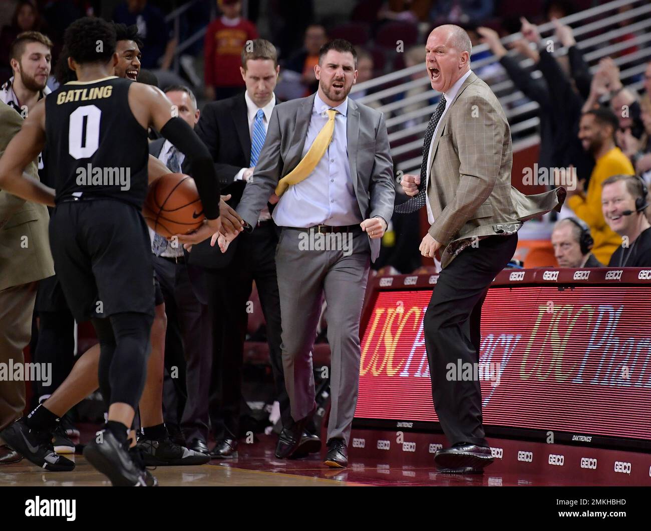 Colorado coach Tad Boyle, right, celebrates after Colorado defeated USC ...
