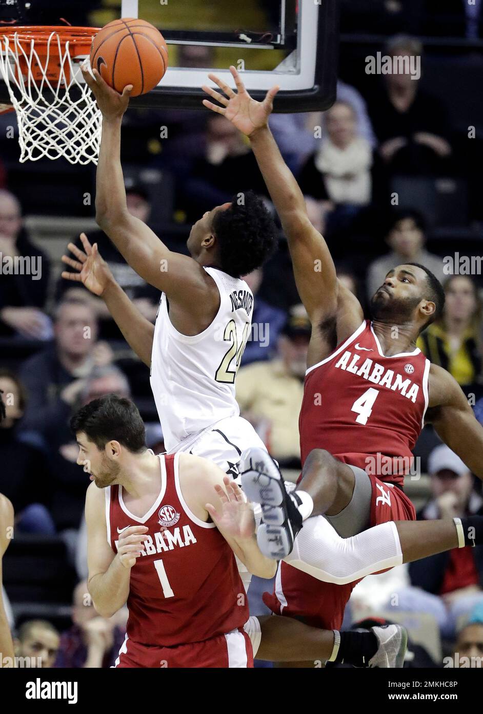 Vanderbilt forward Aaron Nesmith (24) drives against Alabama forward ...