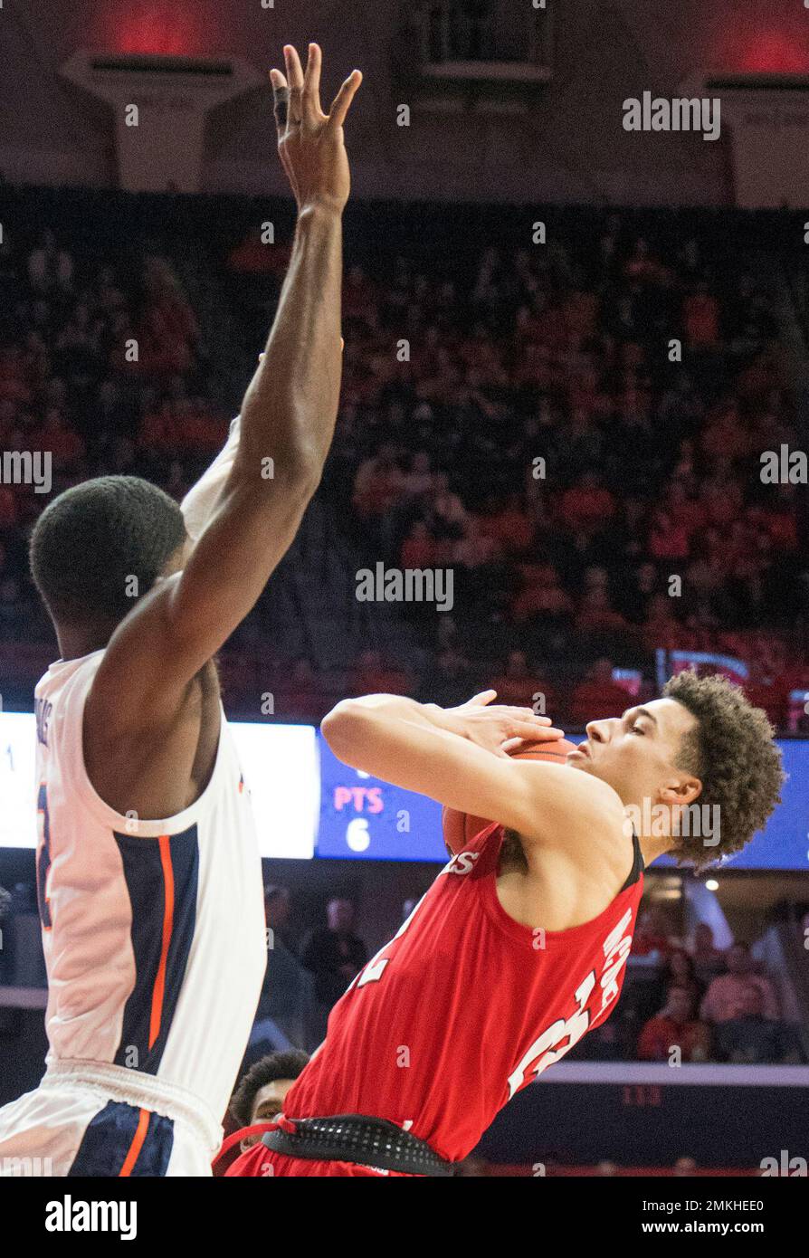 Rutgers guard Montez Mathis, right, goes up against Illinois forward ...