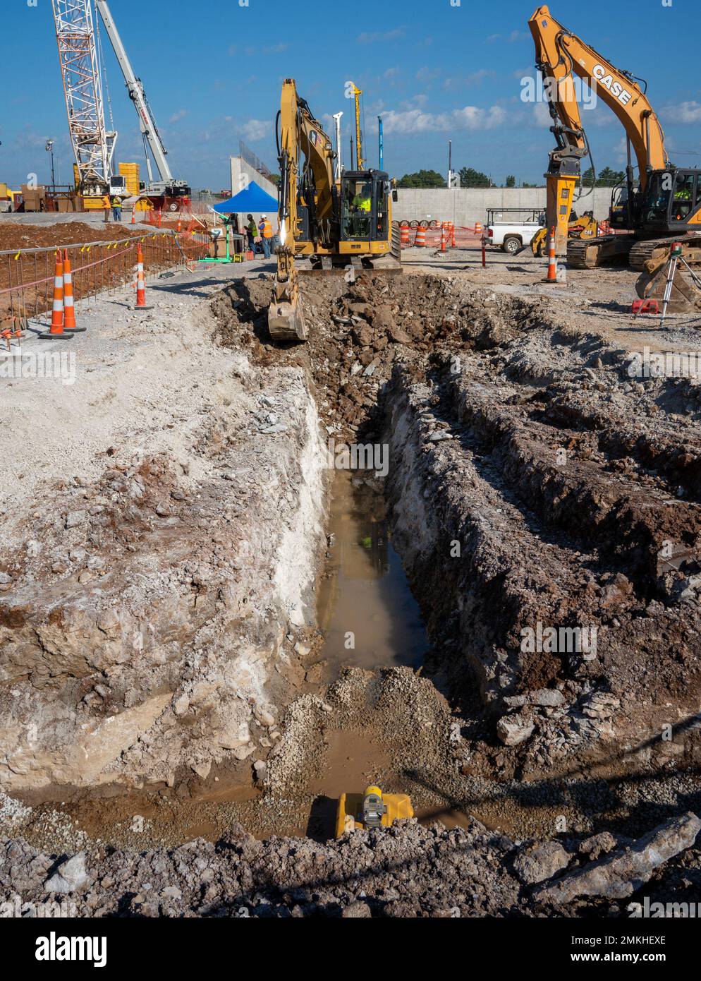 A contractor digs a trench in the basement of the Louisville VA Medical ...