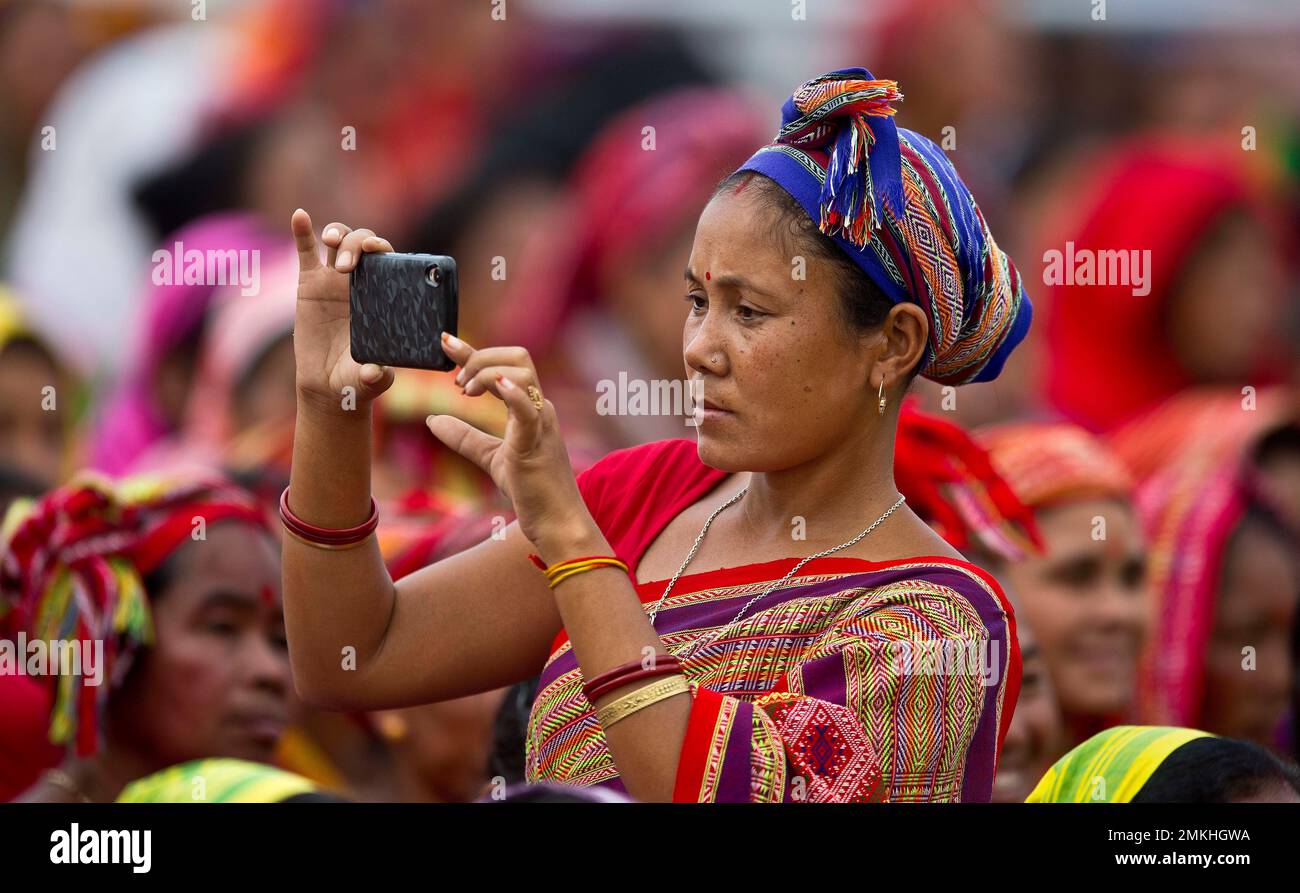 A Bharatiya Janata Party supporter in traditional Rabha attire takes ...