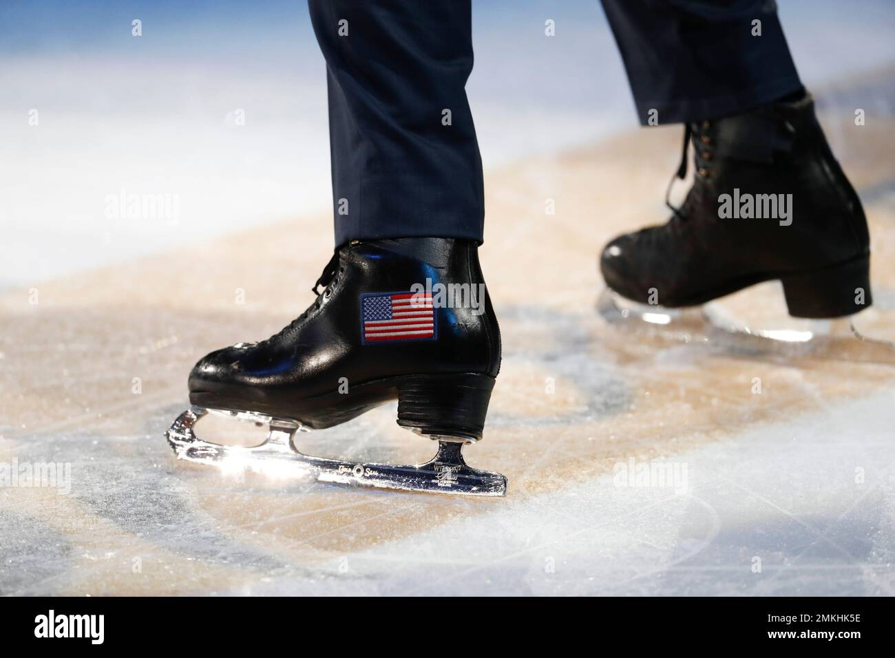 Ice skates with an American flag are shown during a skating exhibition ...