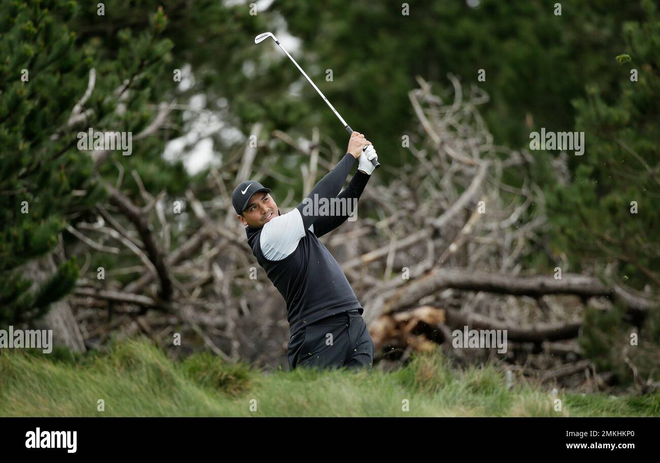 Jason Day, of Australia, follows his shot from the third tee of the ...