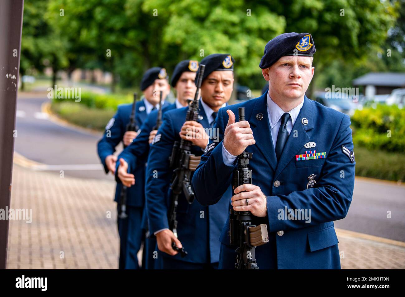Airmen from the 422d Security Forces Squadron, assume the position of ...