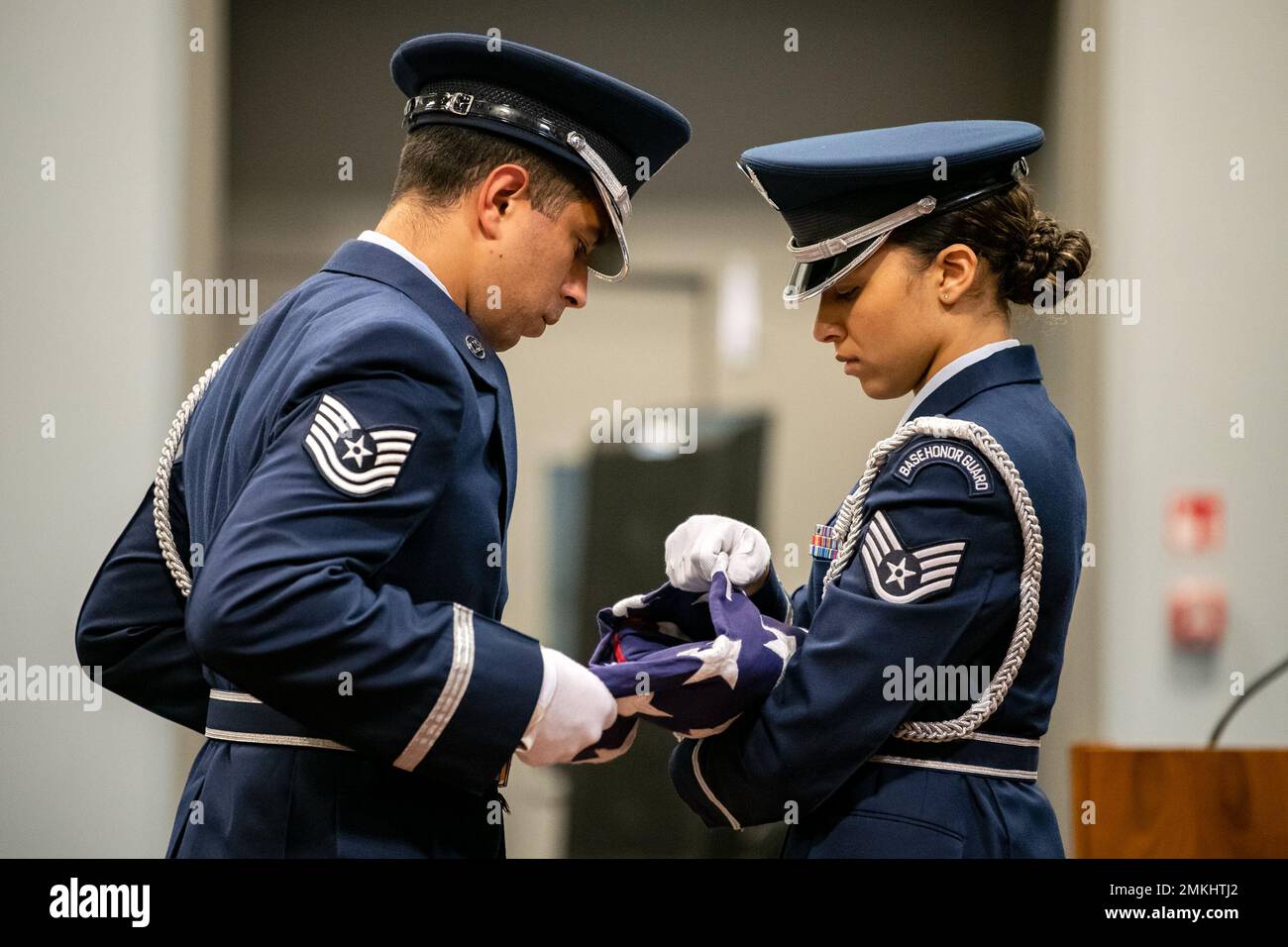 Airmen from the 422d Air Base Group honor guard, fold a flag during a 9 ...