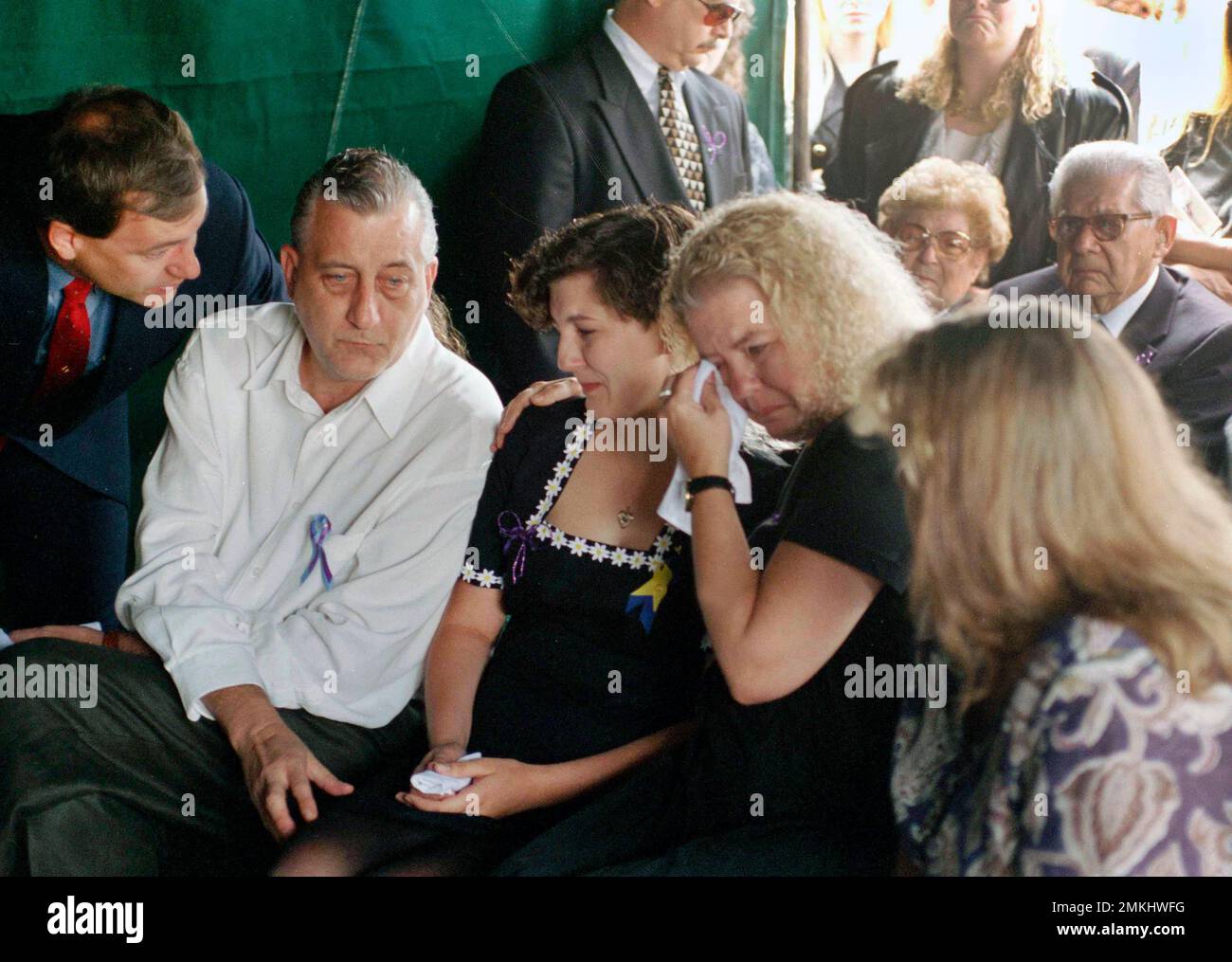Aren Almon, center, whose 1-year-old daughter Baylee became a national ...