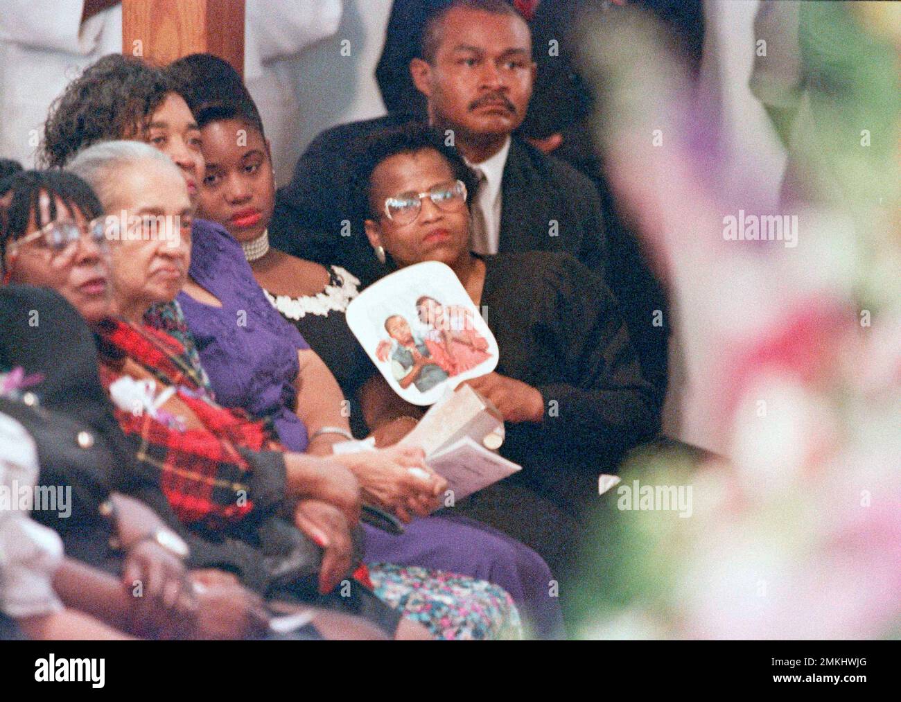 Family members sit in front of the casket of Wanda Howell during ...