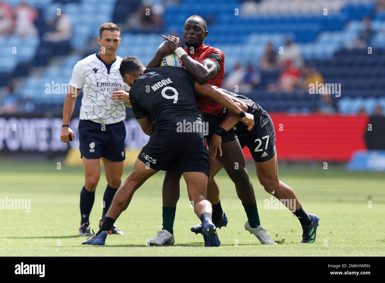 Sydney, Australia. 28th Jan, 2023. Herman Humwa of Kenya is tackled ...