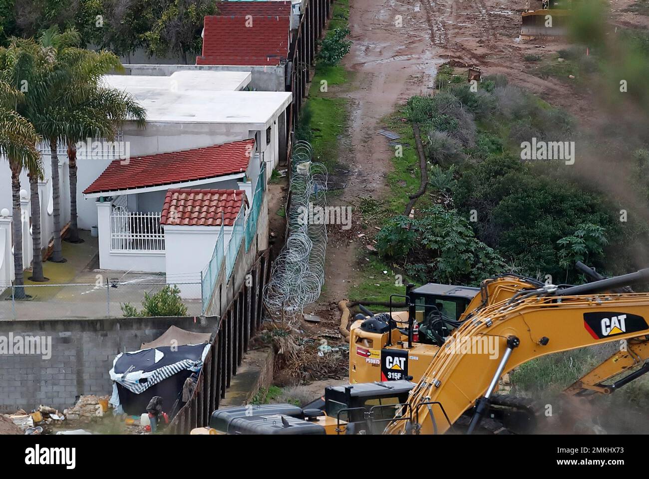 In this Jan 15, 2019 image, structures in Tijuana, Mexico, left of the ...