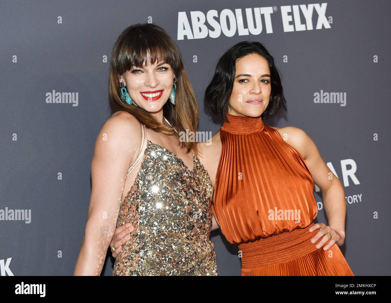 Actors Milla Jovovich, left, and Michelle Rodriguez pose together at ...
