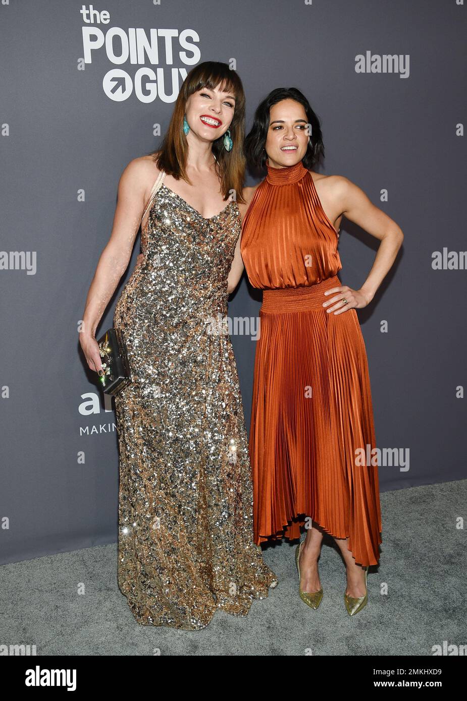 Actors Milla Jovovich, left, and Michelle Rodriguez pose together at ...