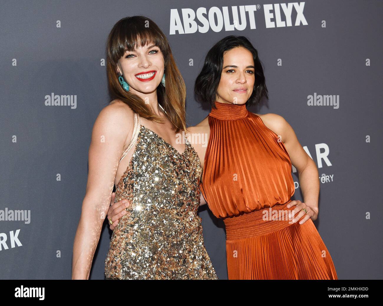 Actors Milla Jovovich, left, and Michelle Rodriguez pose together at ...