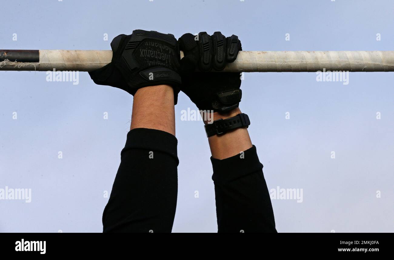 In this Jan. 8, 2019, photo, a paratrooper hangs from an exercise bar ...